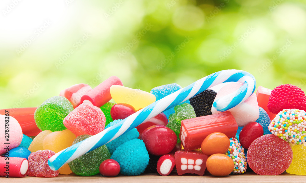 sweets and treats stacked with natural green background Stock Photo ...