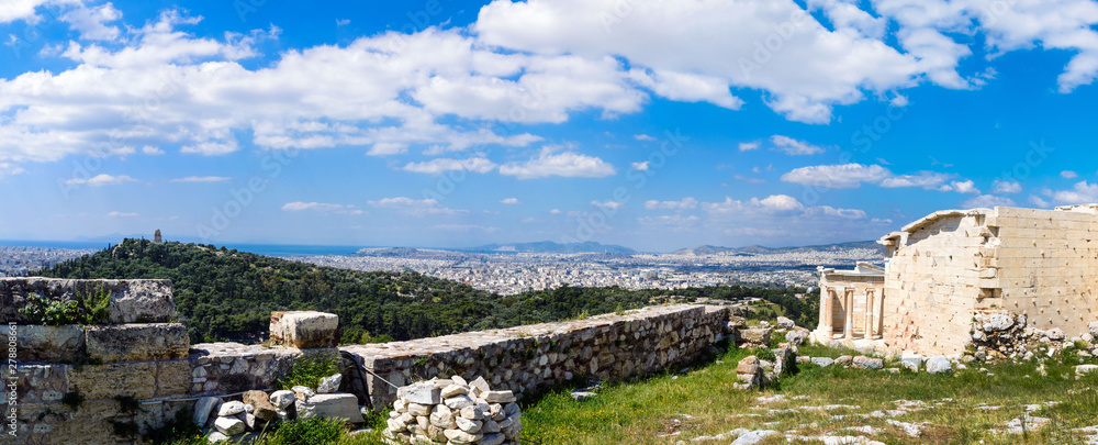 Ancient Greek ruins, ruins amidst lush green grass. Acropolis, Athens ...