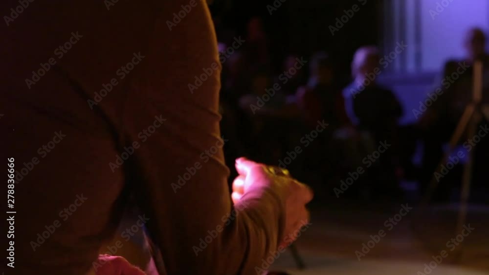 Folk musicians perform intimate gig. Artists are viewed up close on ...