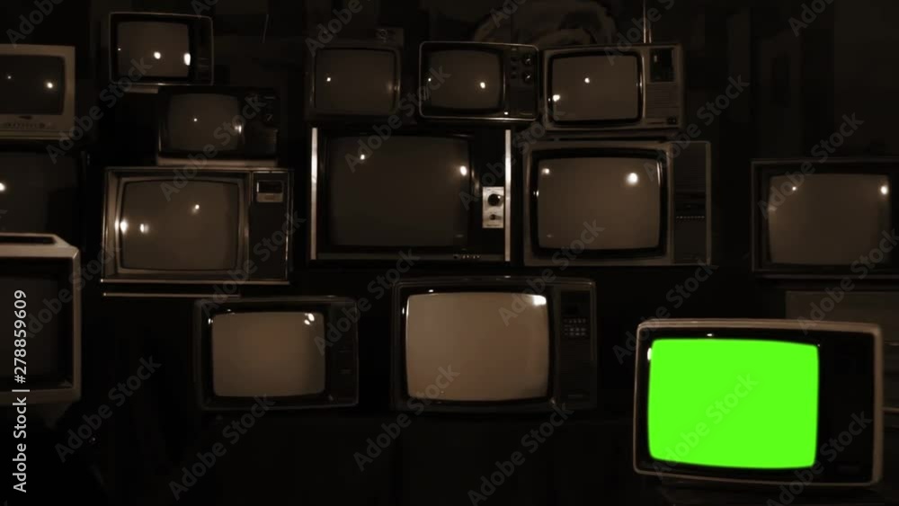 Pile of Retro TVs from 80s and One TV turning On Green Screen. Sepia ...