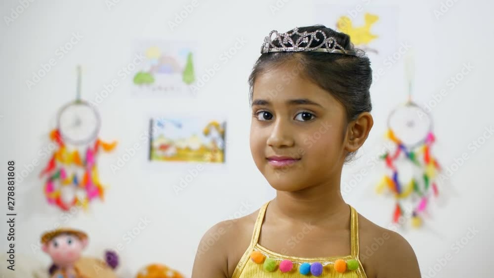 Indian girl with a smile on her face posing at camera - Colorful ...