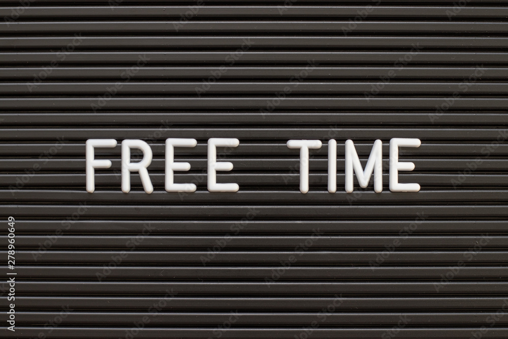 Black color felt letter board with white alphabet in word free time ...