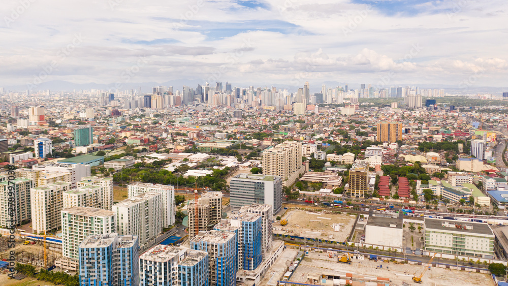 Construction of high modern houses in Manila. The city of Manila, the ...