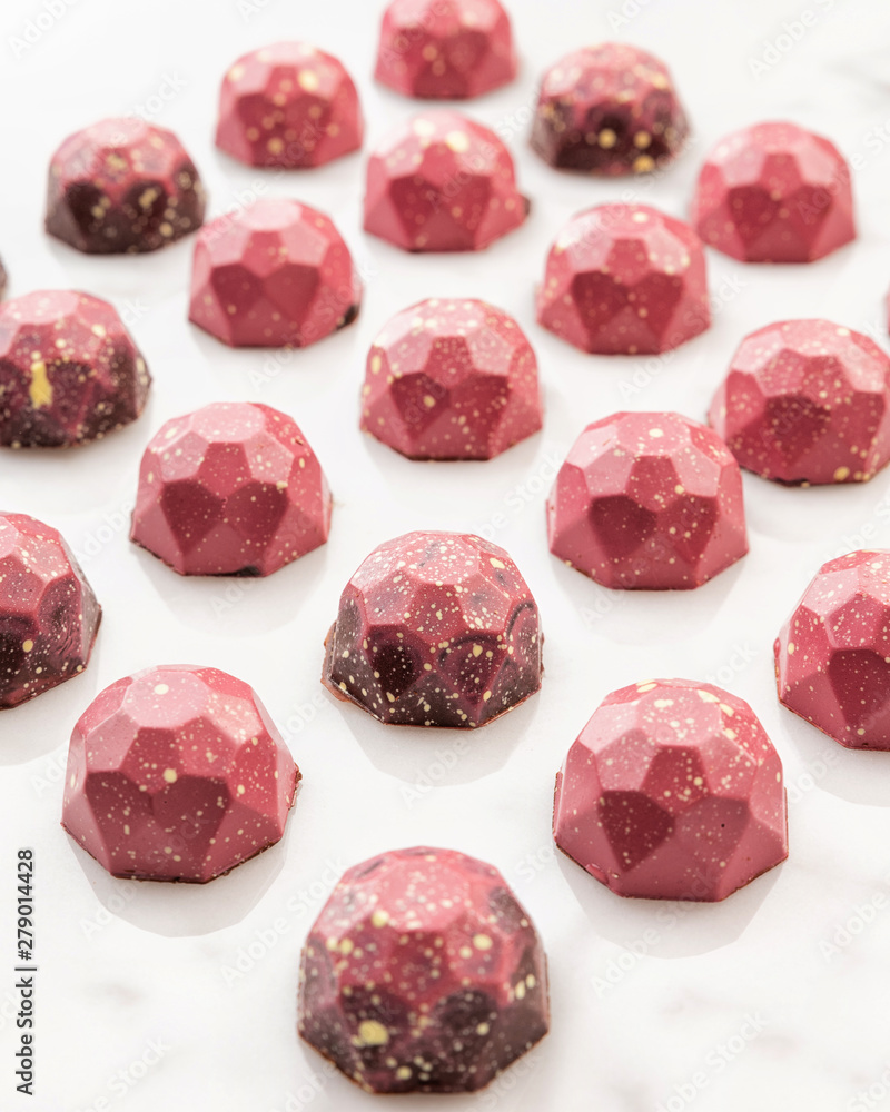 Exclusive handcrafted chocolate candy. Luxury handmade bonbon decorated ...