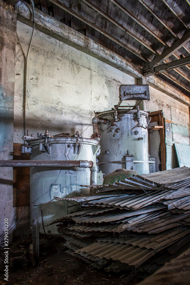 Rusted Worn Interior of Old Industrial Building with Machines and Stack ...