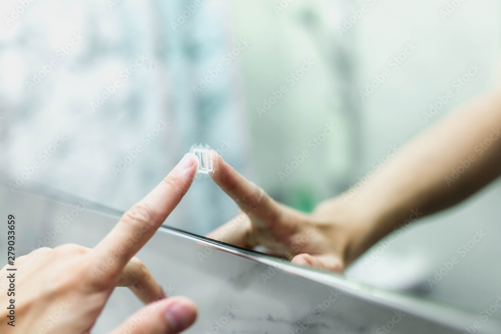 finger touch glowing button on the mirror display. 3d technology in ...