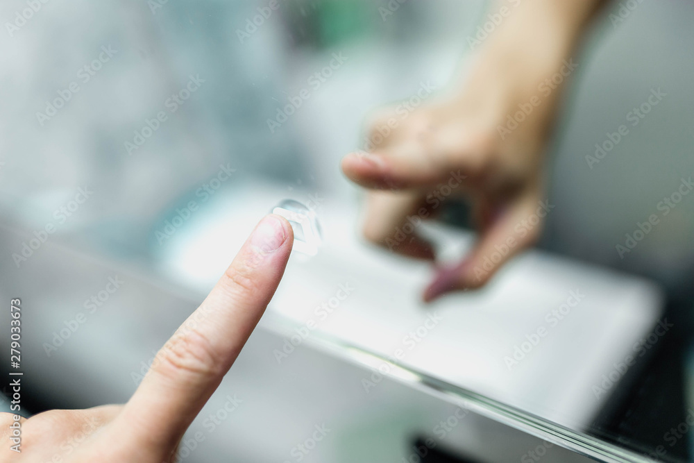 finger touch glowing button on the mirror display. 3d technology in ...