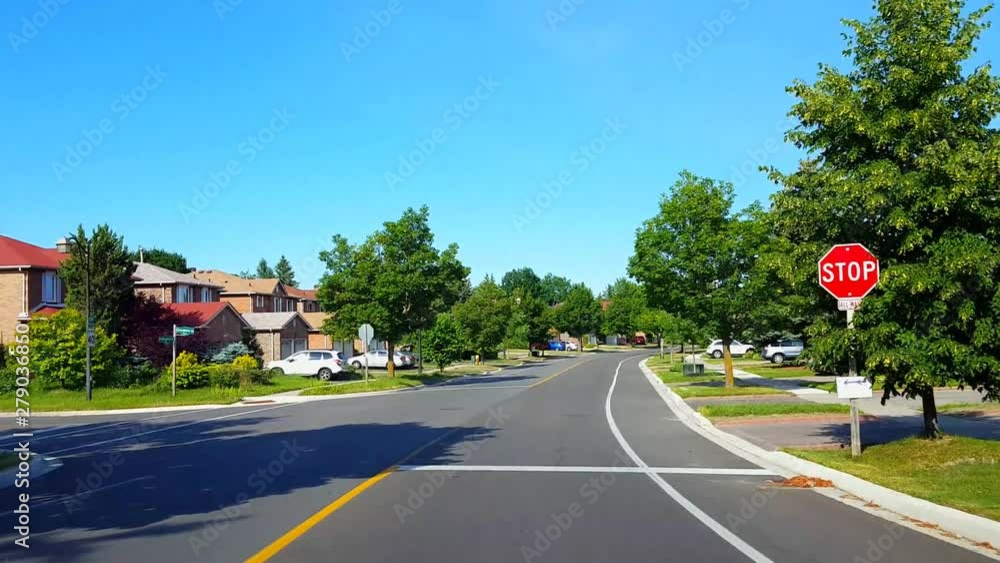 Driving Approaching Stop Sign on Residential City Road With Lush Trees ...