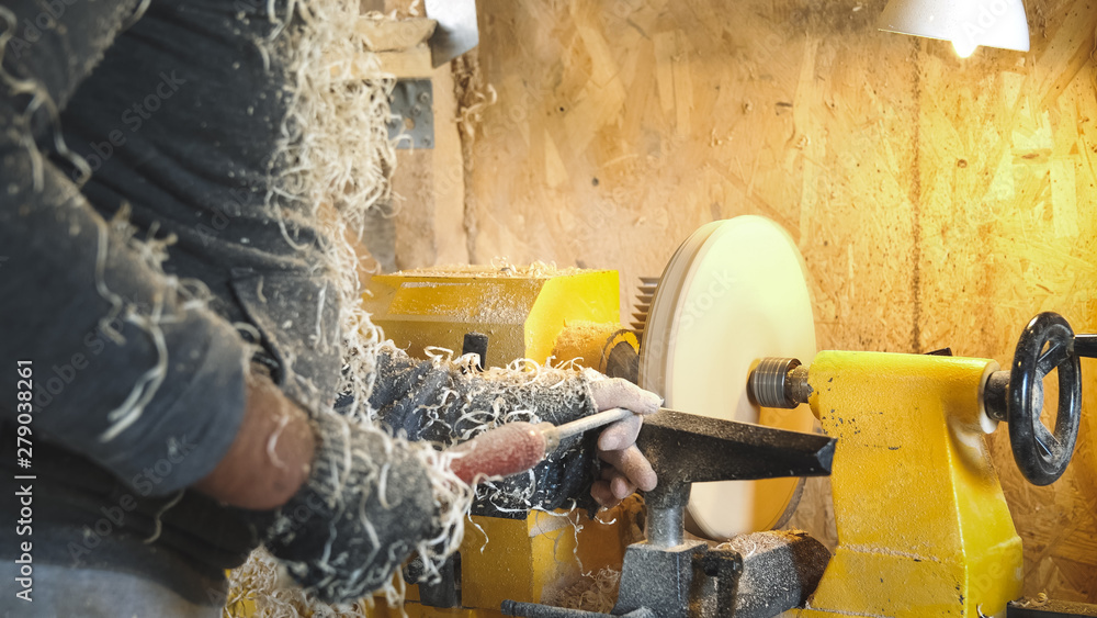 Carpenter cuts wood by graver. Woodworker handles wood by bench. Making ...