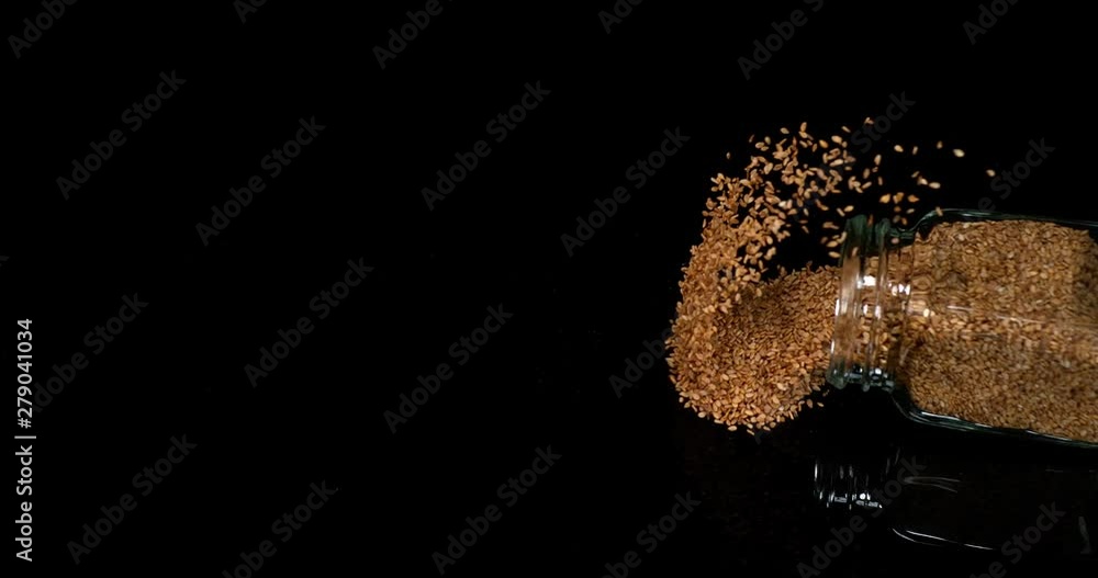 Gold Coloured Sesam, sesamum indicum, Seeds falling against Black ...