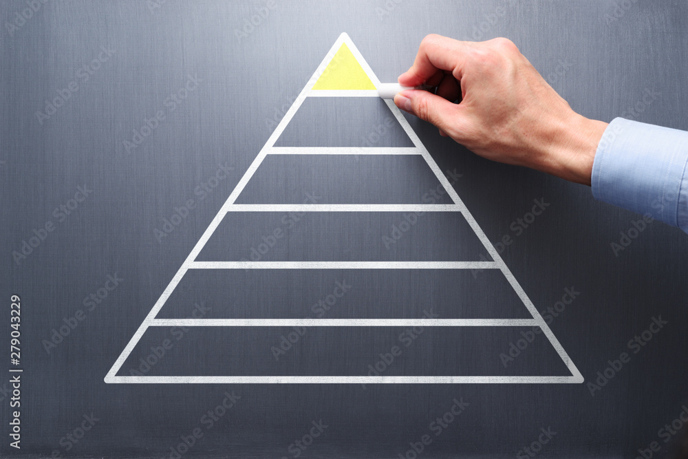 Structure of company organization. Businessman drawing pyramid on ...
