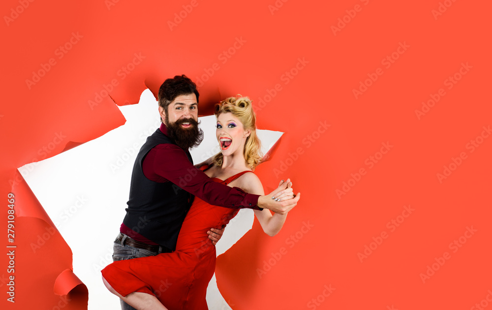 Cute young couple dancing. Pretty woman and bearded man dance tango ...