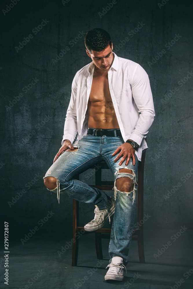 Muscular Men in Jeans Wearing Shirt Exposing his Muscular Build Stock ...