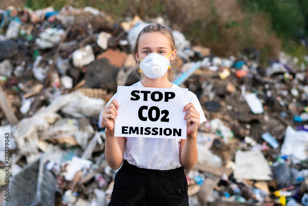 Woman Activist With Stop CO2 Emission Poster On Waste Dump. Recycle ...