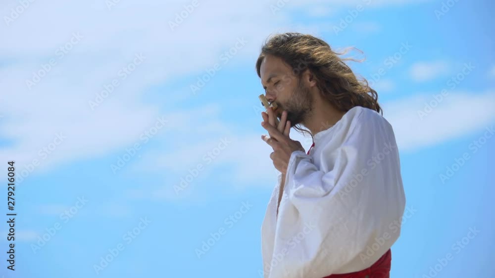 Jesus kissing wooden cross, praying to God, accepting trials and ...