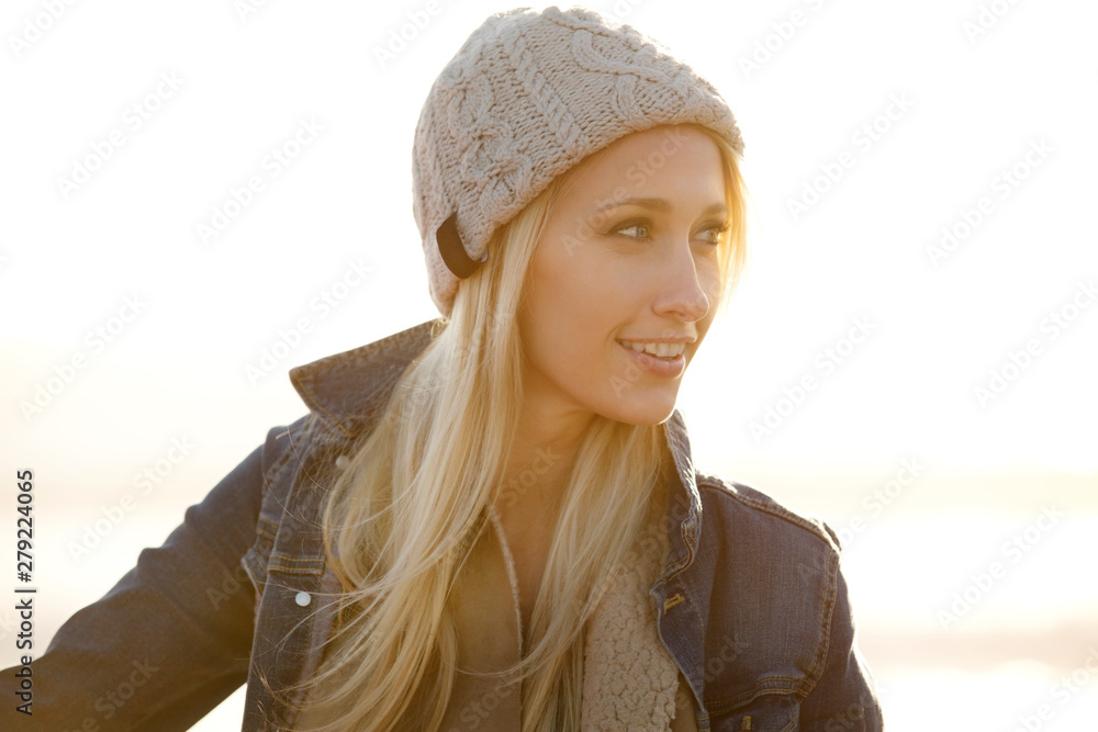 Portrait of young woman wearing knit hat Stock Photo | Adobe Stock