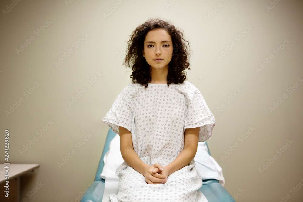 Portrait of patient sitting on hospital bed Stock Photo | Adobe Stock