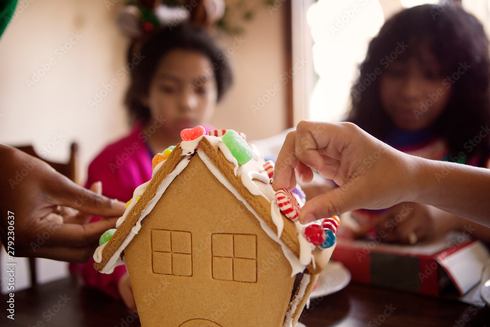 Family making gingerbread house Stock Photo | Adobe Stock