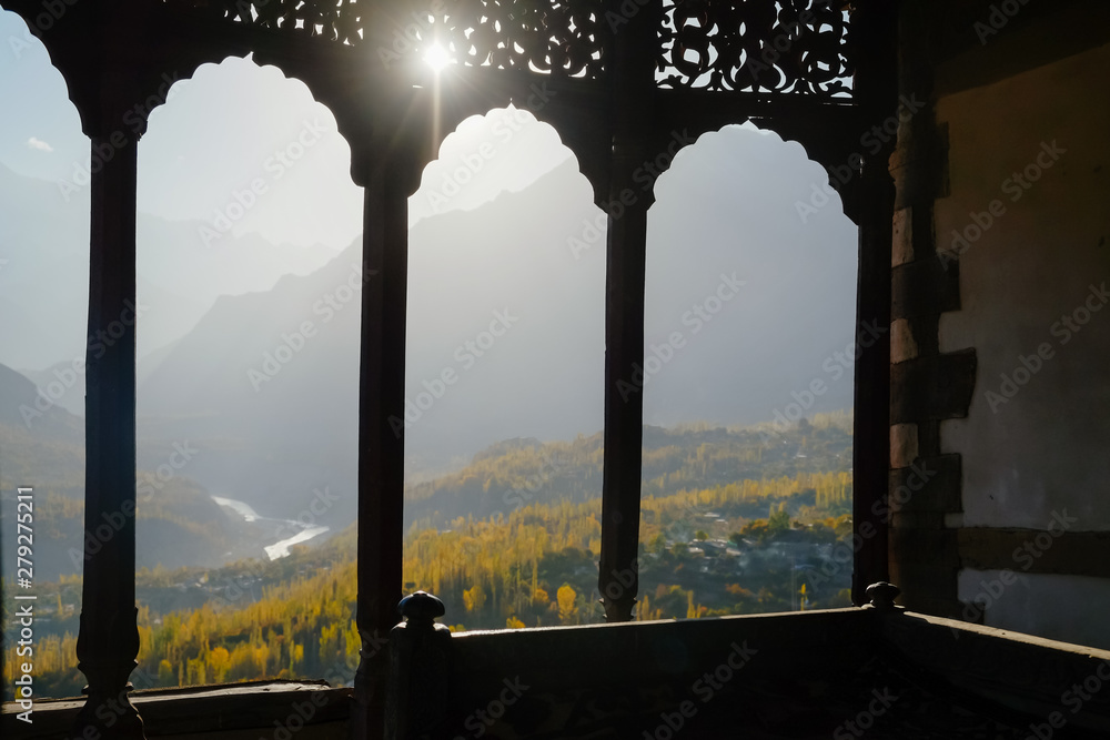Vintage window of Baltit fort with a blurry landscape view of Hunza ...