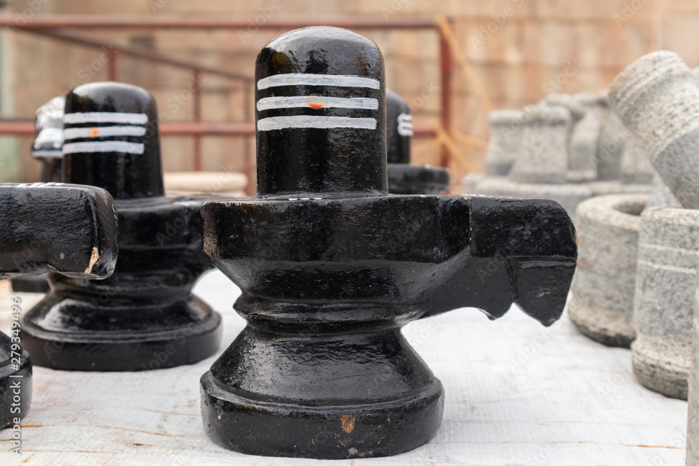 Stone Shiva Linga sculpture's selling on the road side of the Hampi ...