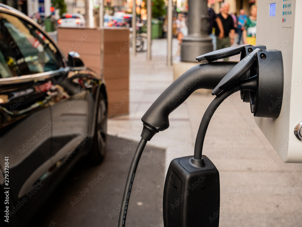 Recharge your electric vehicle here for free Stock Photo | Adobe Stock