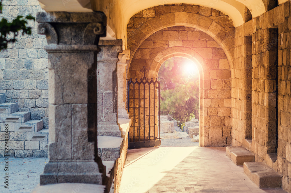 A romantic Medieval room. Beautiful sun light coming through an arch ...