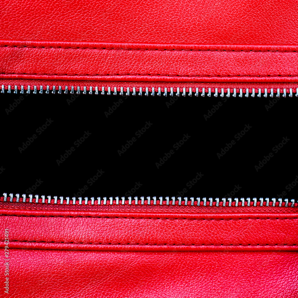 Zipper open between two layers of red leather fabric with visible seam ...