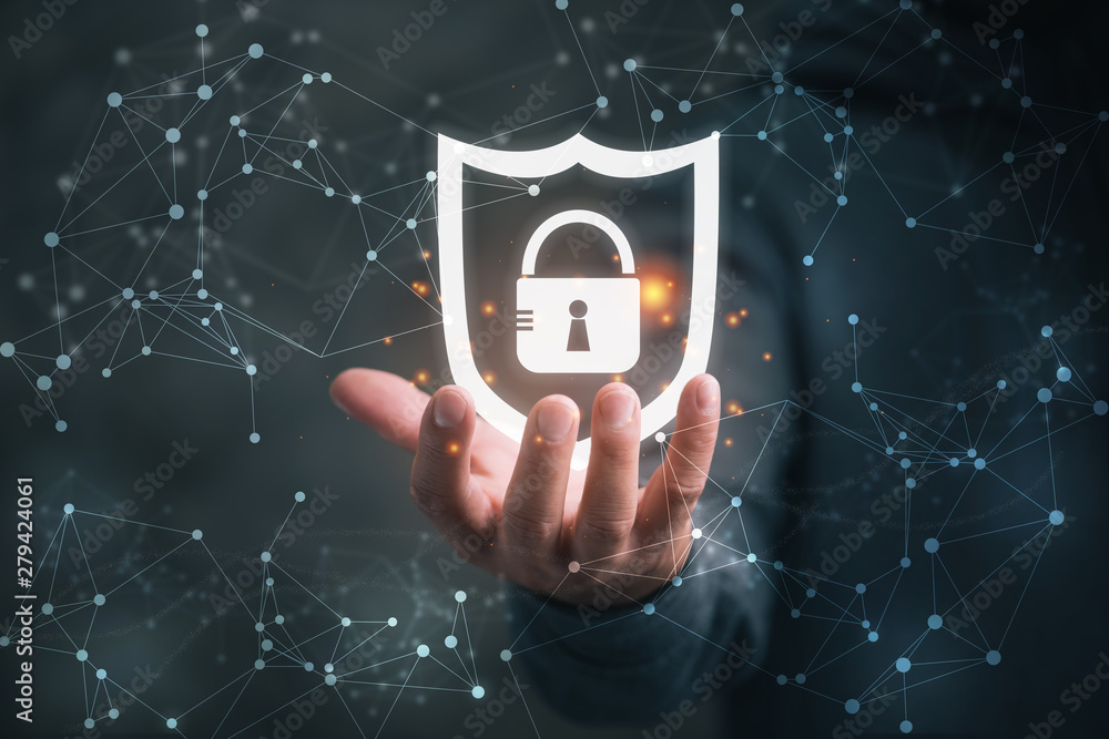 man holding virtual icon shield with a lock symbol, concept about ...