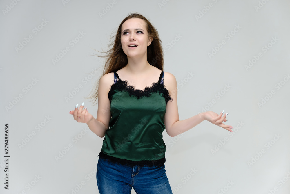 Concept portrait above the knee of a pretty girl, young woman with long ...