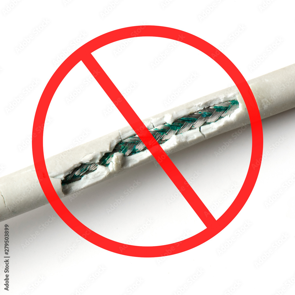 Torn wire insulation. Red prohibition sign. The concept of the ...