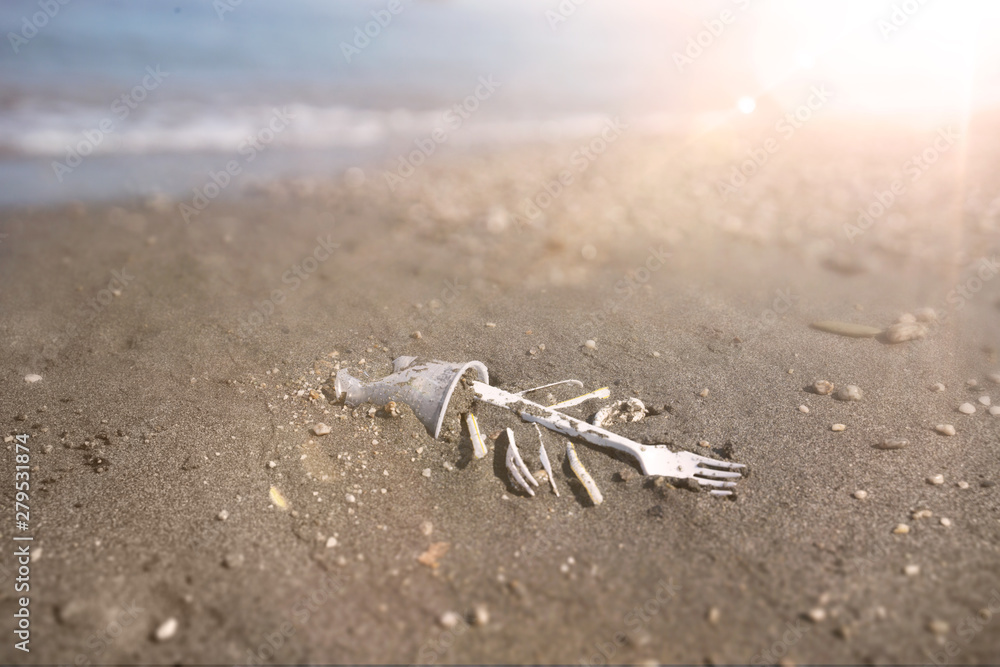 singleuse plastic waste on the beach as fishbone Stock Photo | Adobe Stock