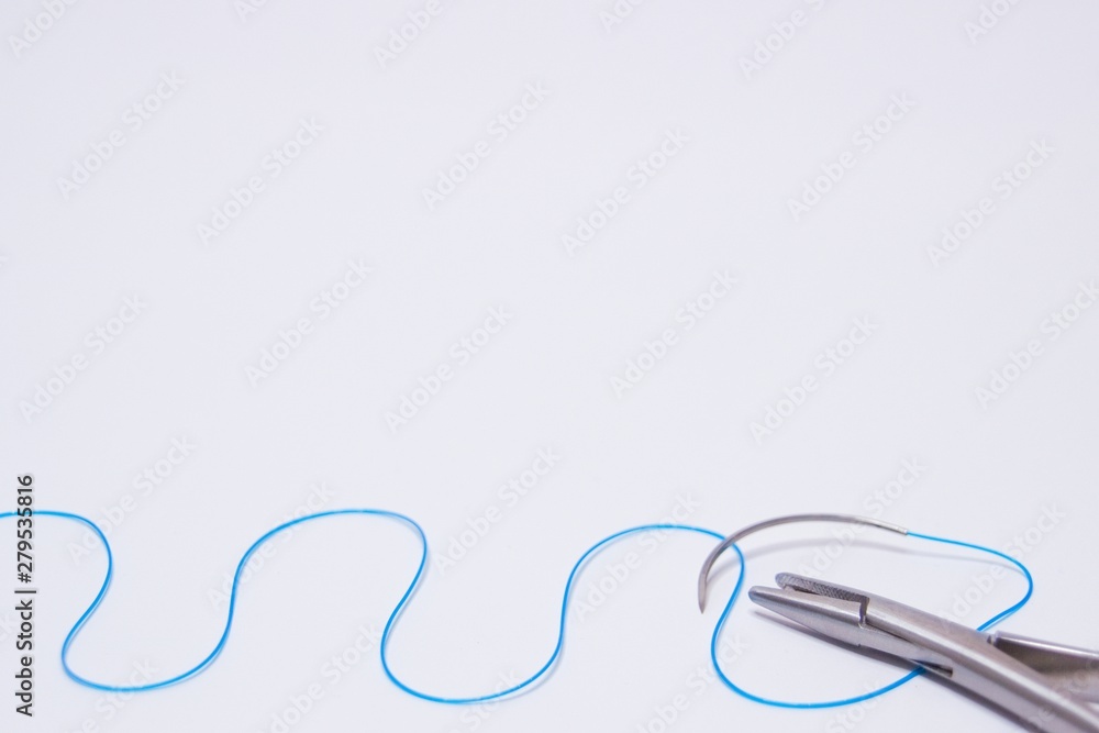 Medical equipment for sewing wounds. The kit includes a needle holder ...