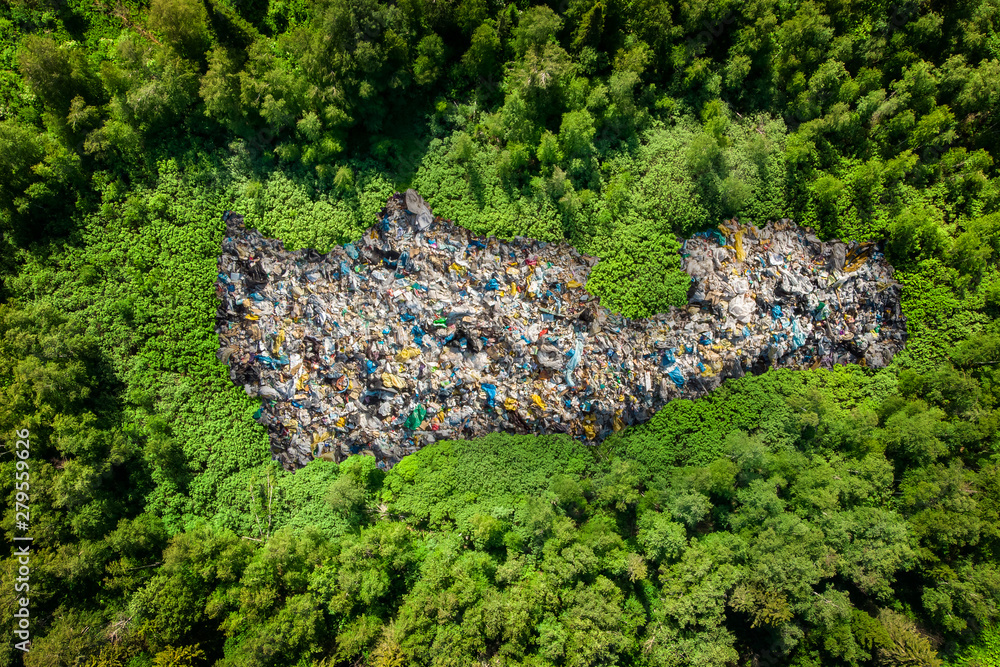 Trash waste plastic and packages on clean green field. Concept ...