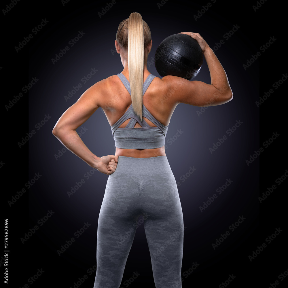 Backside view of female athlete fitness trainer athlete, muscular back ...