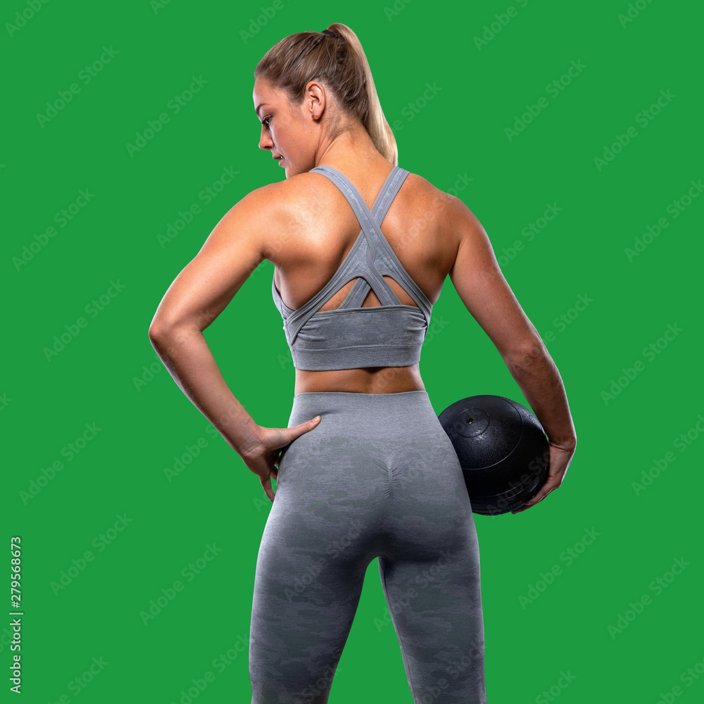 Physical fitness trainer, muscular back and buttocks, standing proud ...