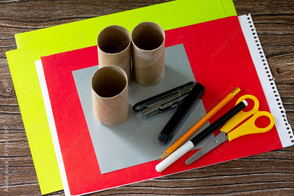 Child cuts out details Paper Roll Pencil Holder the new school year ...