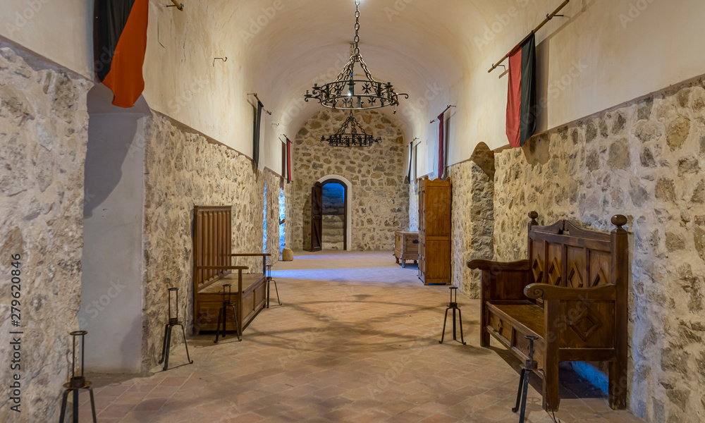 Interior of a medieval castle in Toledo, Spain. Stone rooms with wooden ...