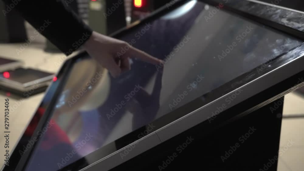 Child touches map with solar system and planets on the touch screen ...