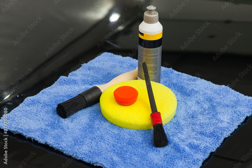 A set of tools for polishing and washing a car consisting of blue ...
