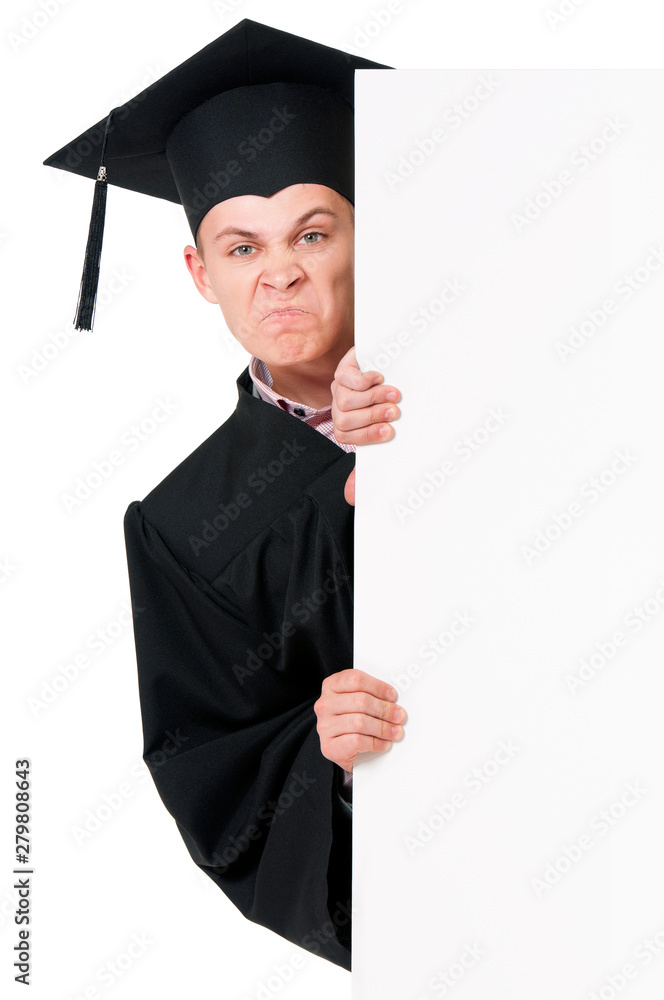 Angry male graduate student peeking from behind a blank panel, isolated ...