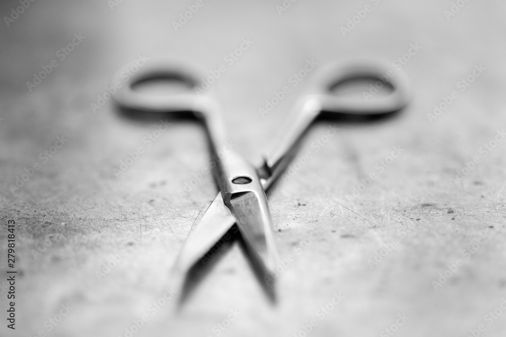 Old surgical scissors on a metal table, shallow depth of field. Stock ...