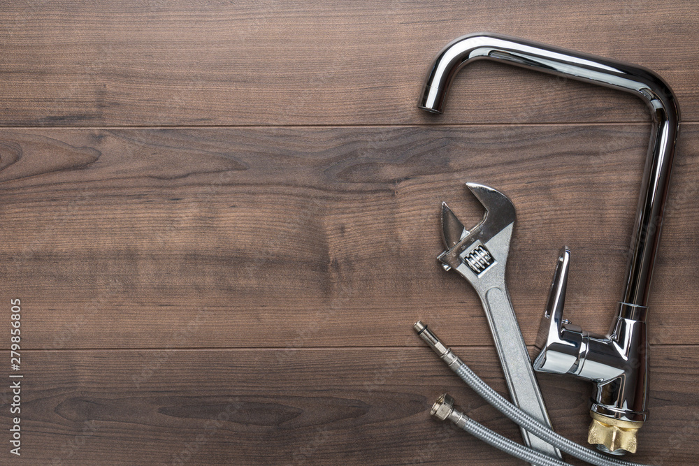 Foto Stock Top view photo of plumbing tools on brown table. Right side ...