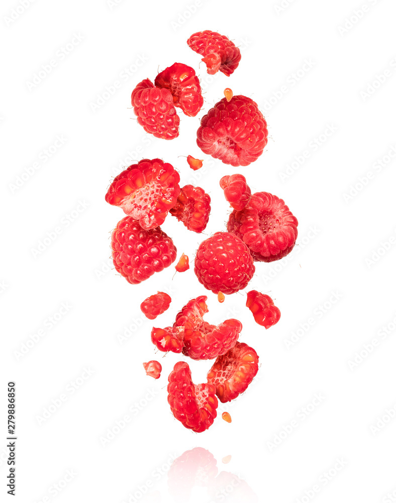 Whole and sliced raspberries in the air isolated on a white background ...