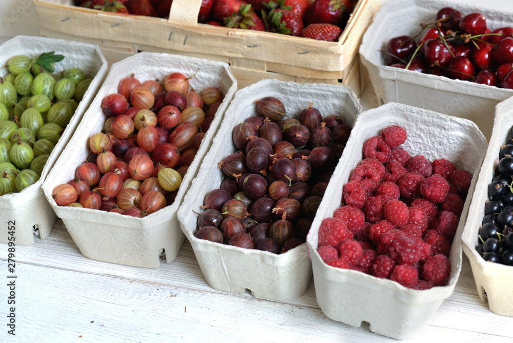 organic fruit stand with seasonal fruits and berries in the local ...