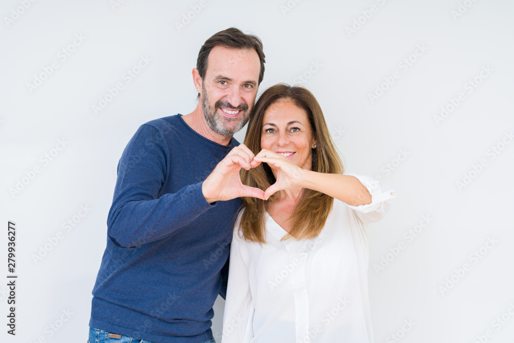 Beautiful middle age couple in love over isolated background smiling in ...