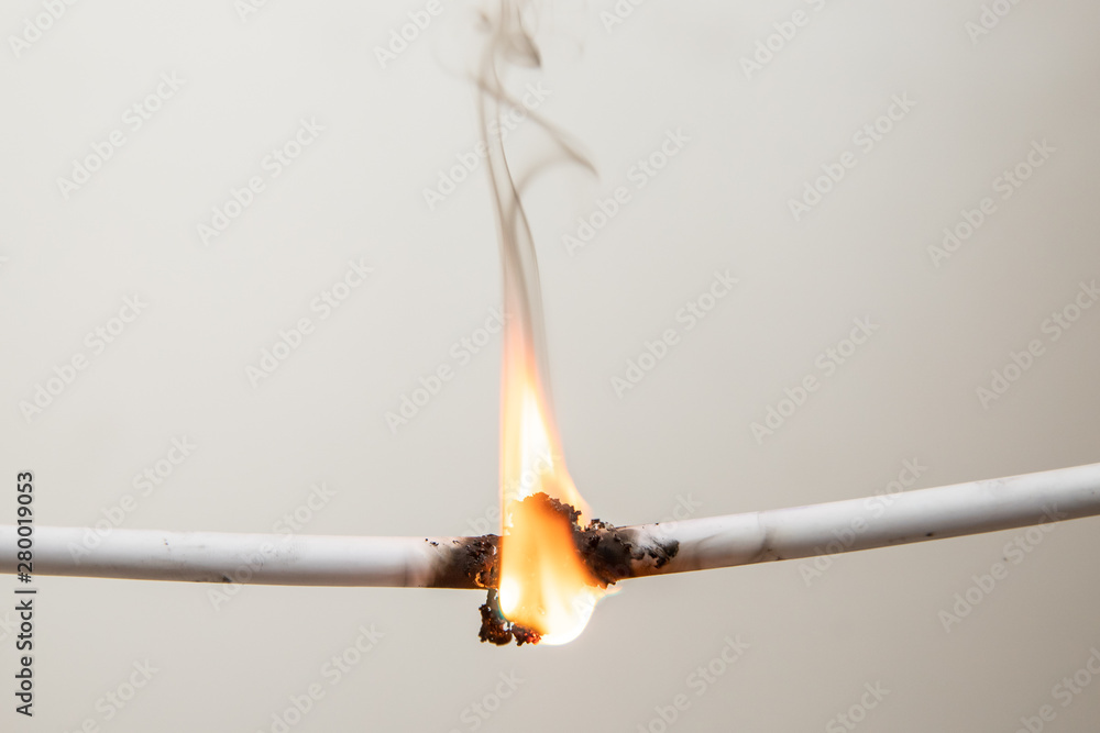 Electrical short circuit. Wiring cable on fire flame Stock Photo ...