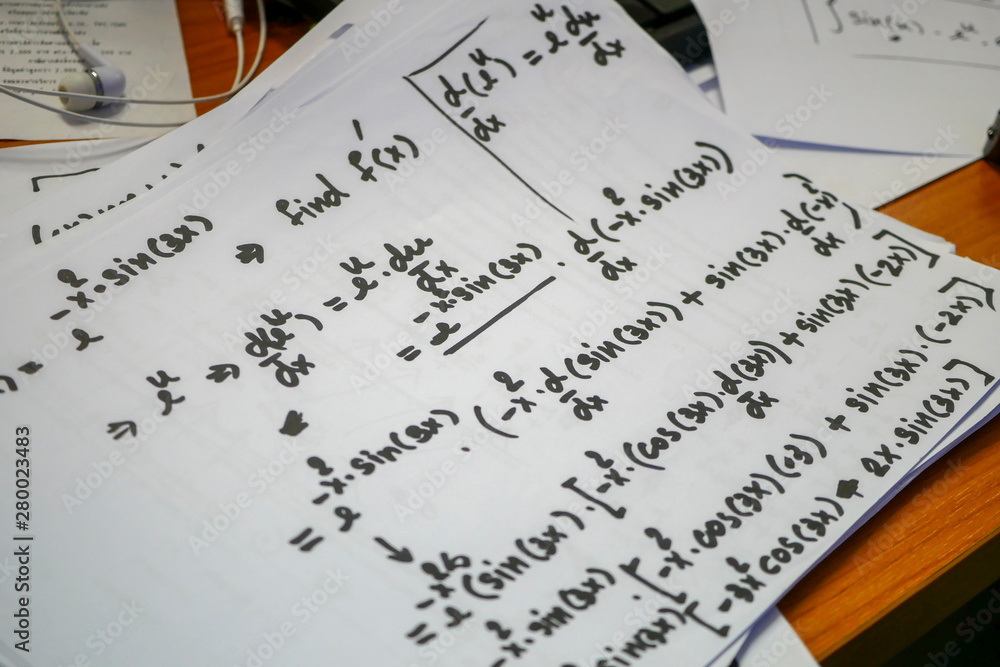 Differentiation solving problem, equations outlines on white paper ...