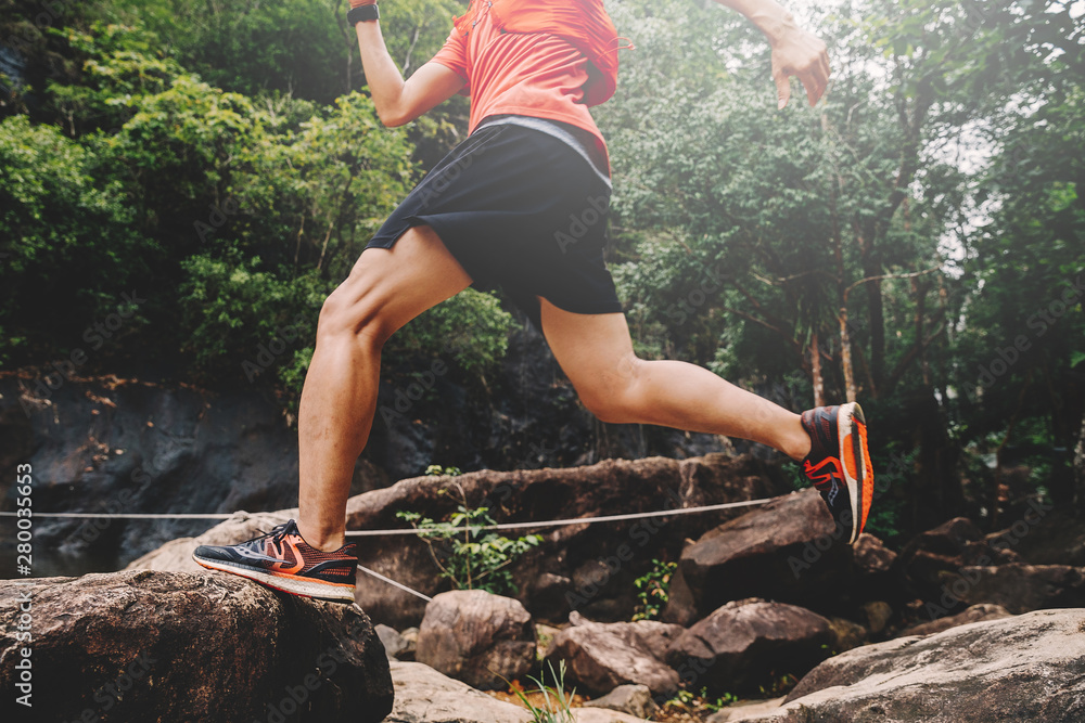 Runners. Young people trail running on a mountain path. Adventure trail ...