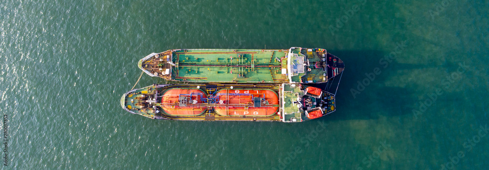 Aerial top view of the ship carrying the lpg and oil tanker in the sea ...