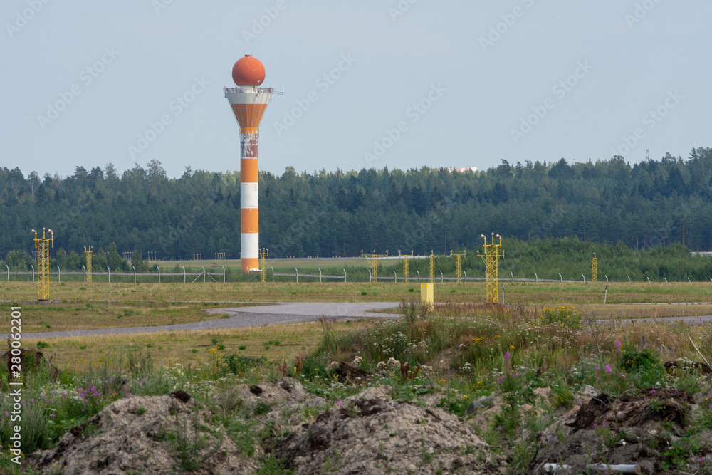 Radar pole and approach lights at the end of airport runway Stock Photo ...